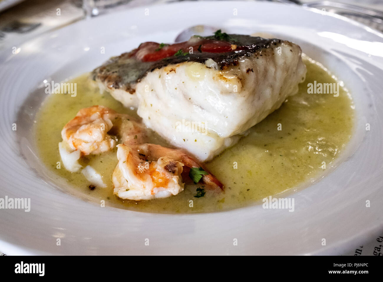 Hake dish with prawns and clams Stock Photo - Alamy