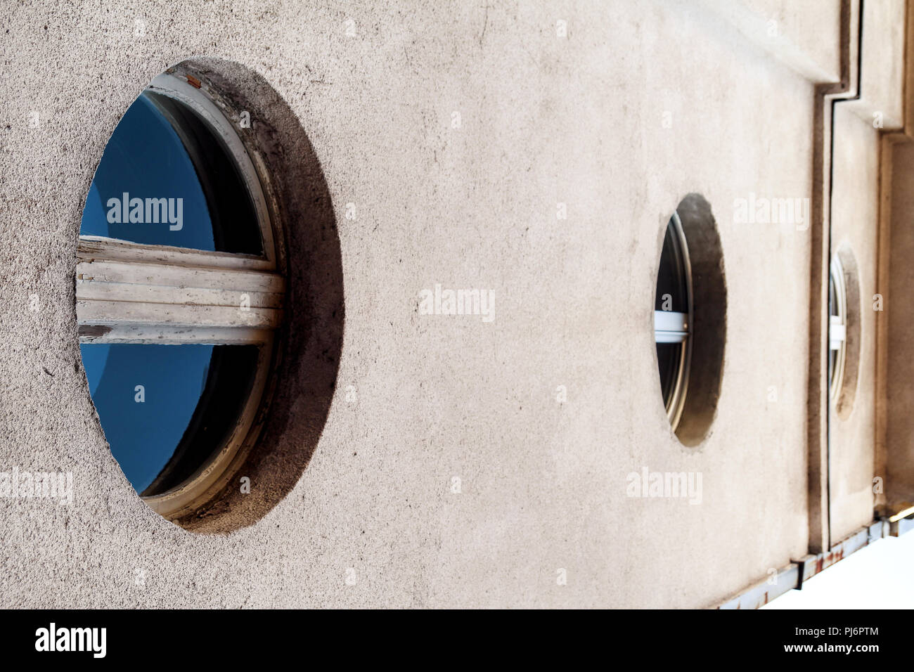 Circular windows. The circular windows with blue glass. Modern ...