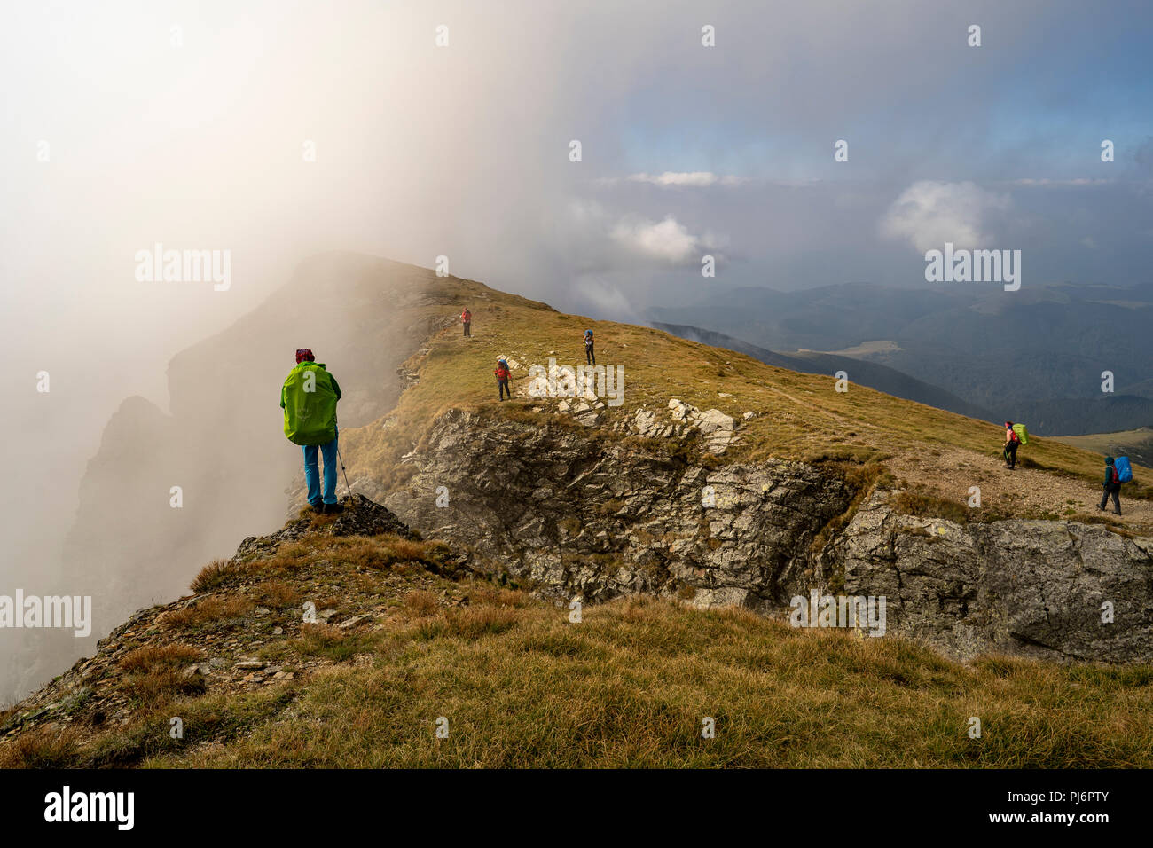 Hikers enthusiasts reach Parangul Mare, 2519m altitude, during a 3 days ...