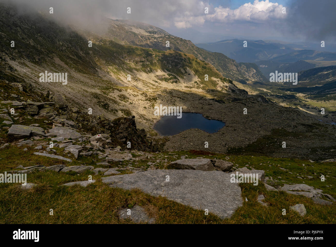 Hikers enthusiasts reach Parangul Mare, 2519m altitude, during a 3 days ...