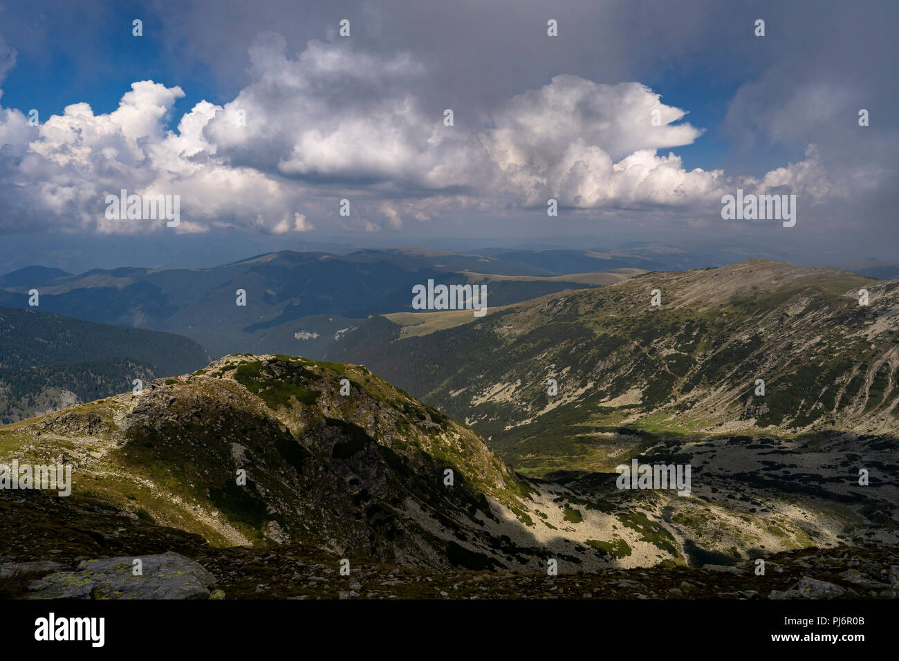 Hikers enthusiasts reach Parangul Mare, 2519m altitude, during a 3 days ...