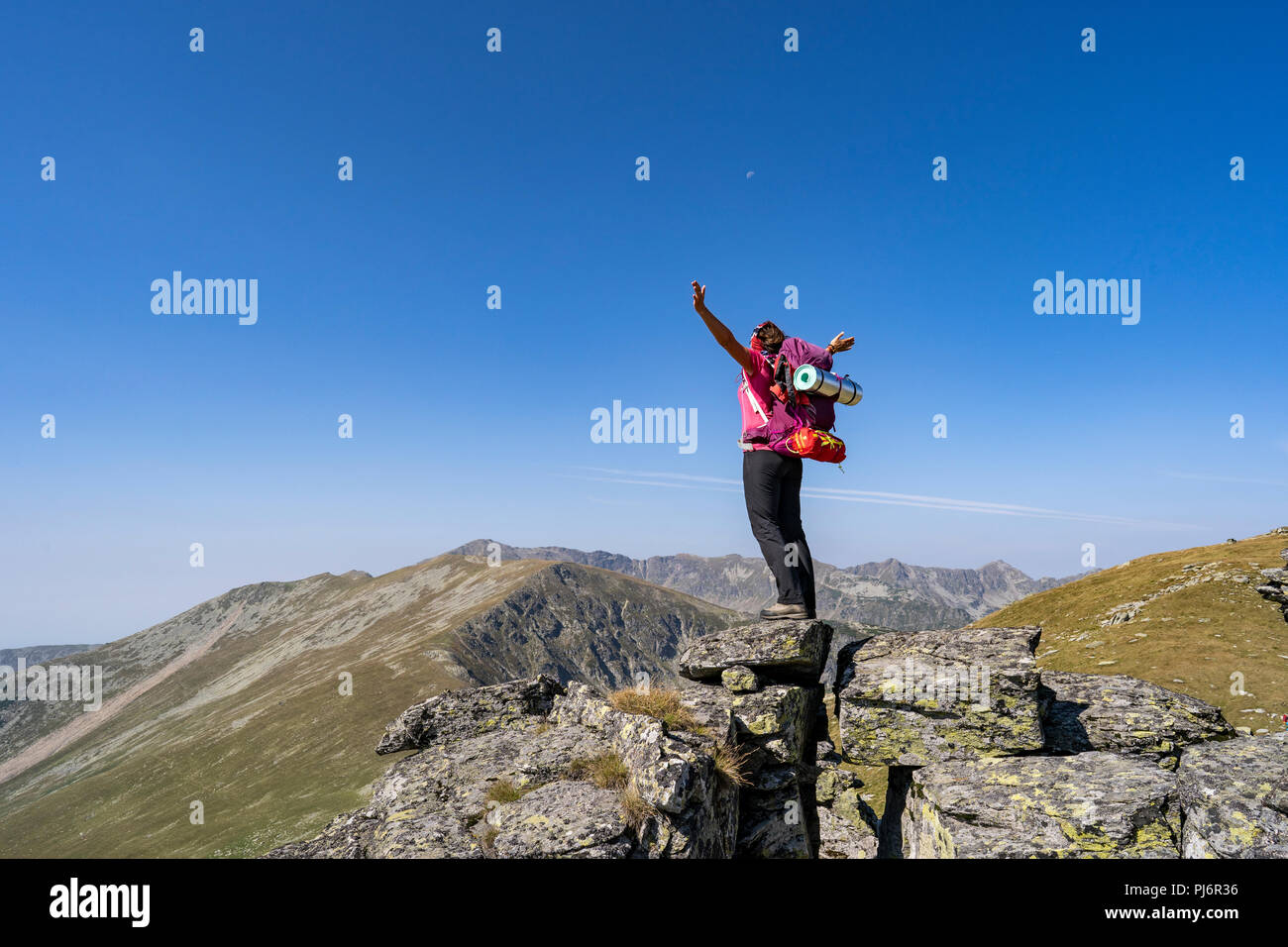Hikers enthusiasts reach Parangul Mare, 2519m altitude, during a 3 days ...