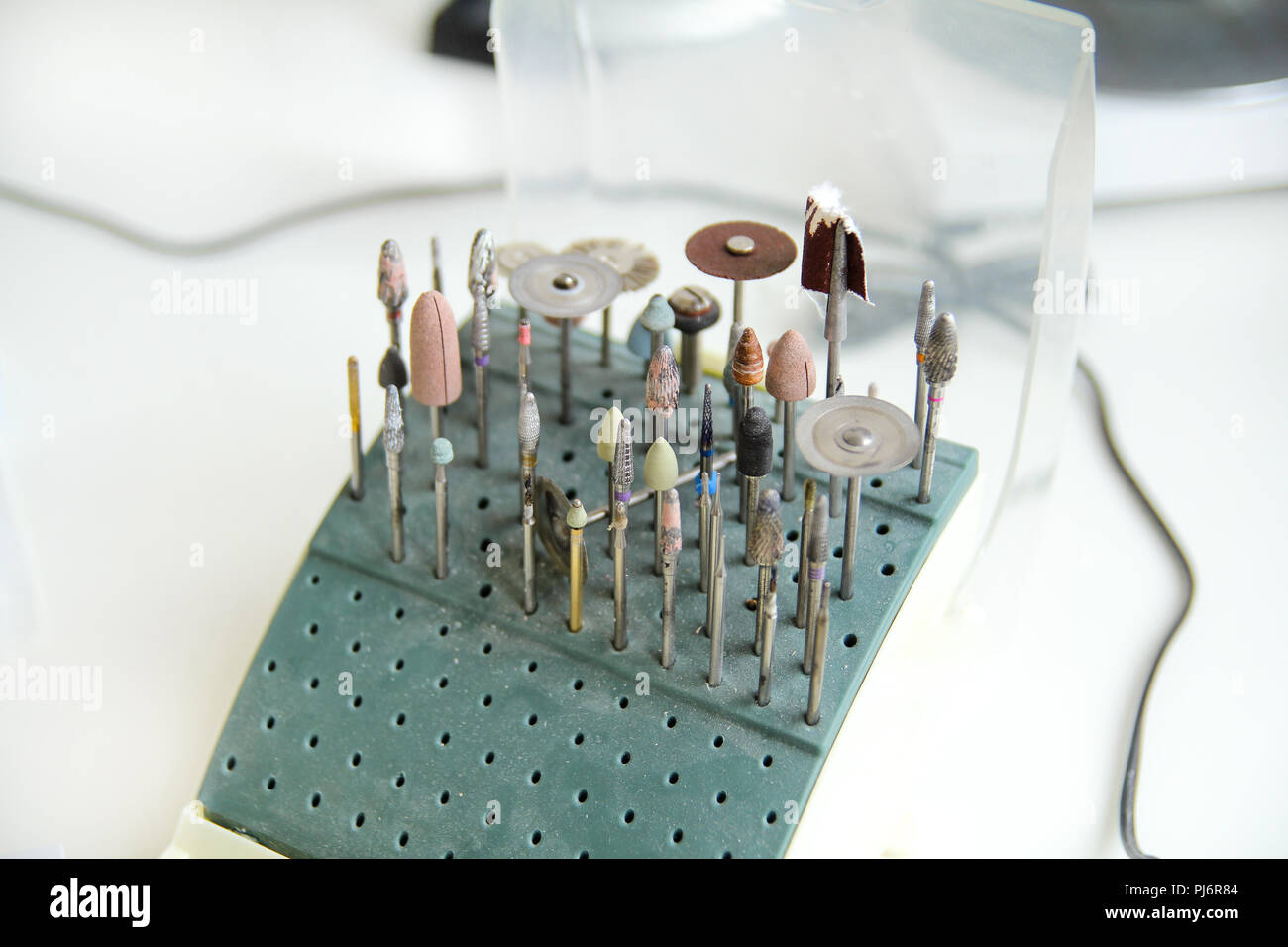 Different dental tools and burs. Dentures and dentistry. Dental ...