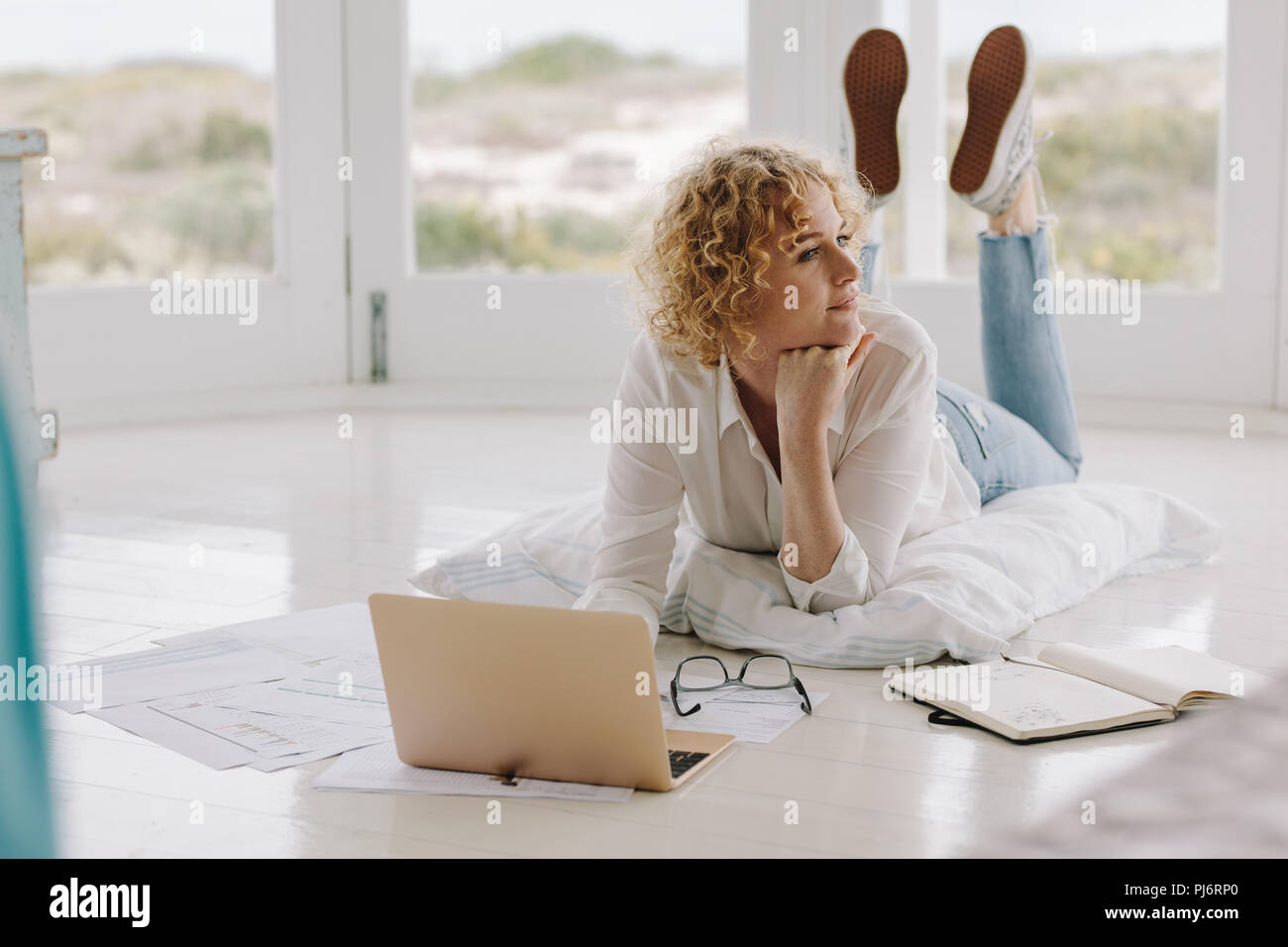 Person lying on floor hi-res stock photography and images - Alamy