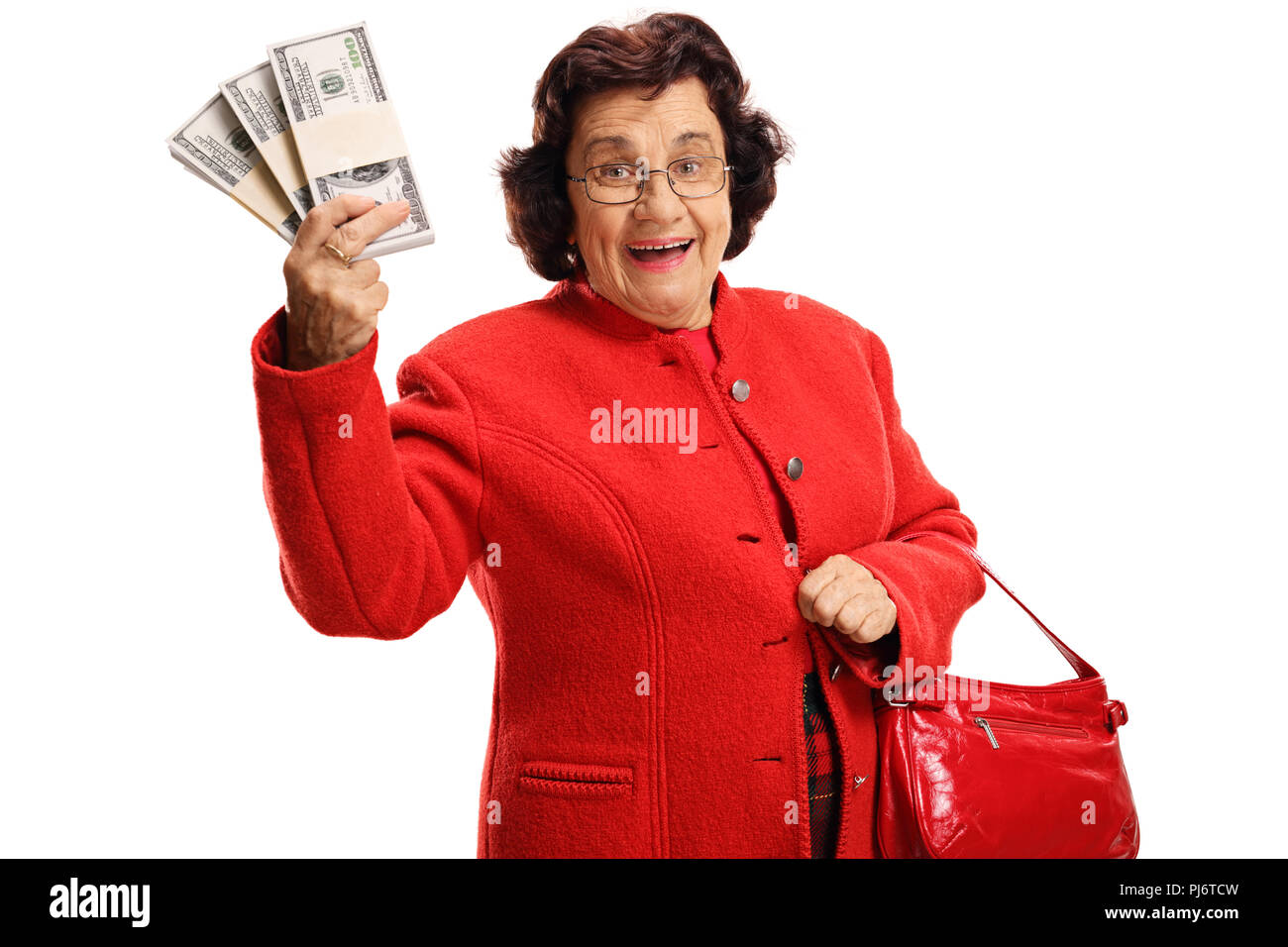 Rich mature woman holding money and purse isolated on white background ...