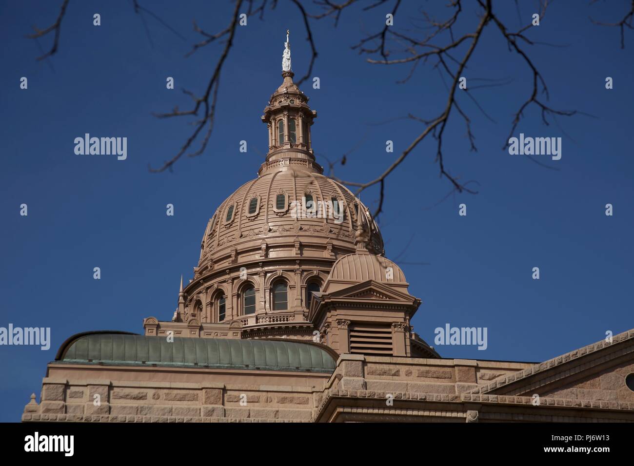 The Texas capitol building and dome with the Texas flag in Austin Texas ...