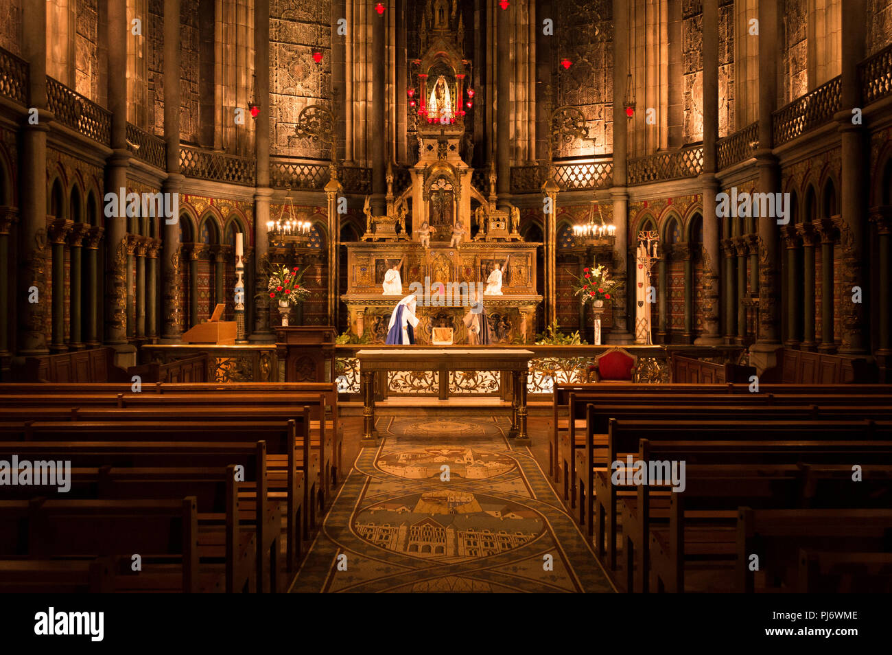 Christmas time inside a European old church. Soft warm lights ...