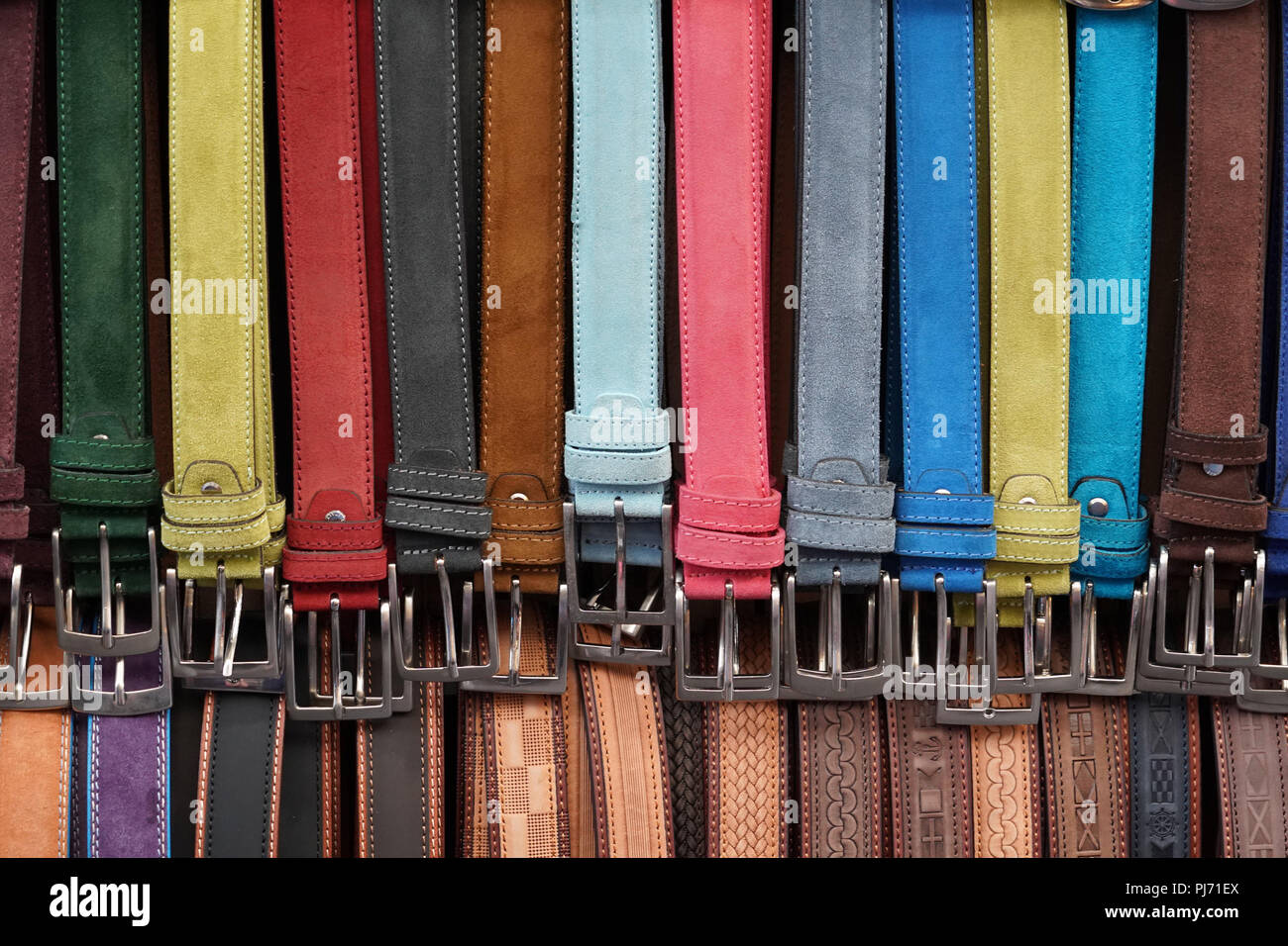 different colors leather belt on display at the market for sale Stock ...
