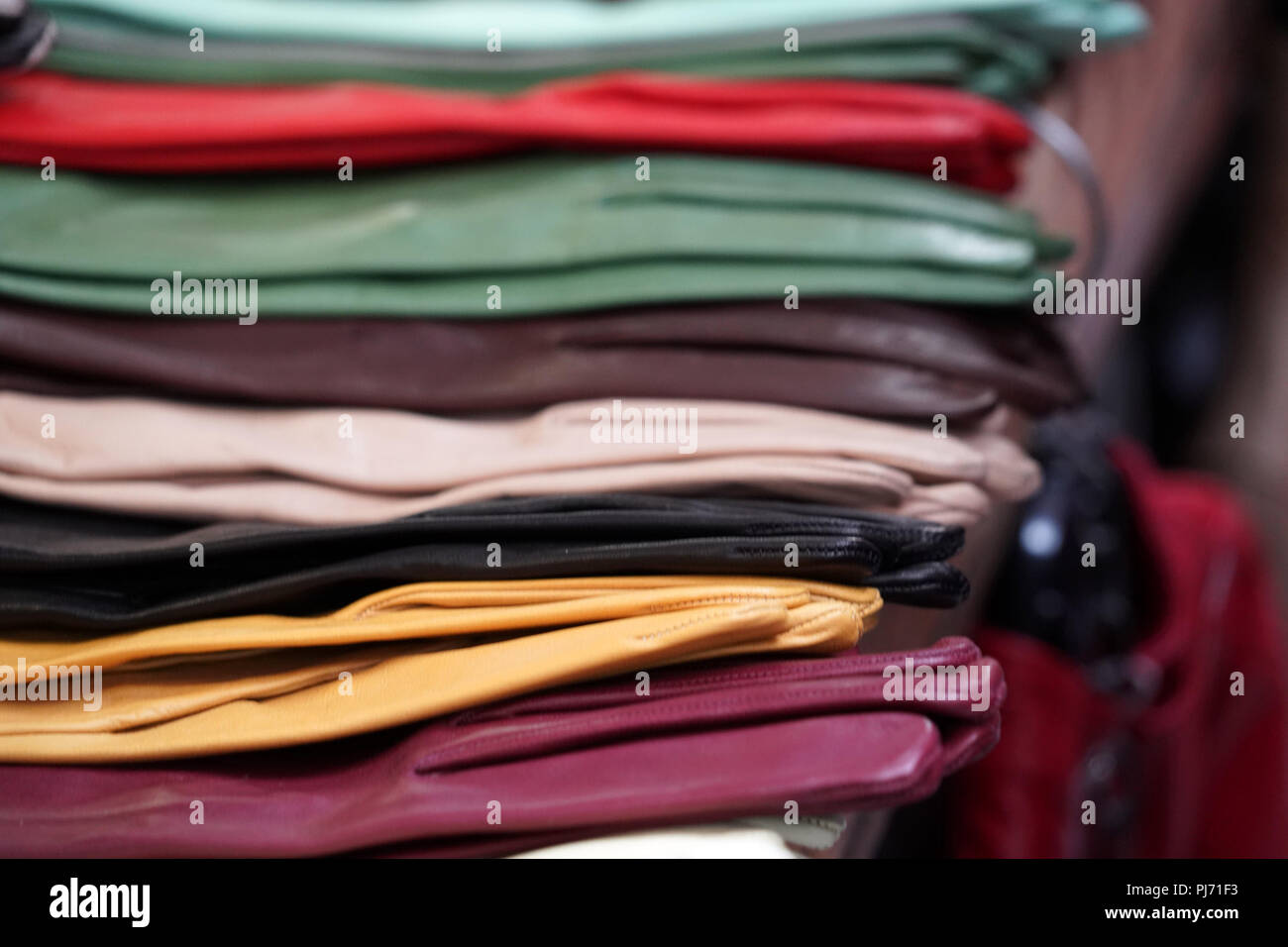 different colors leather gloves on display Stock Photo - Alamy