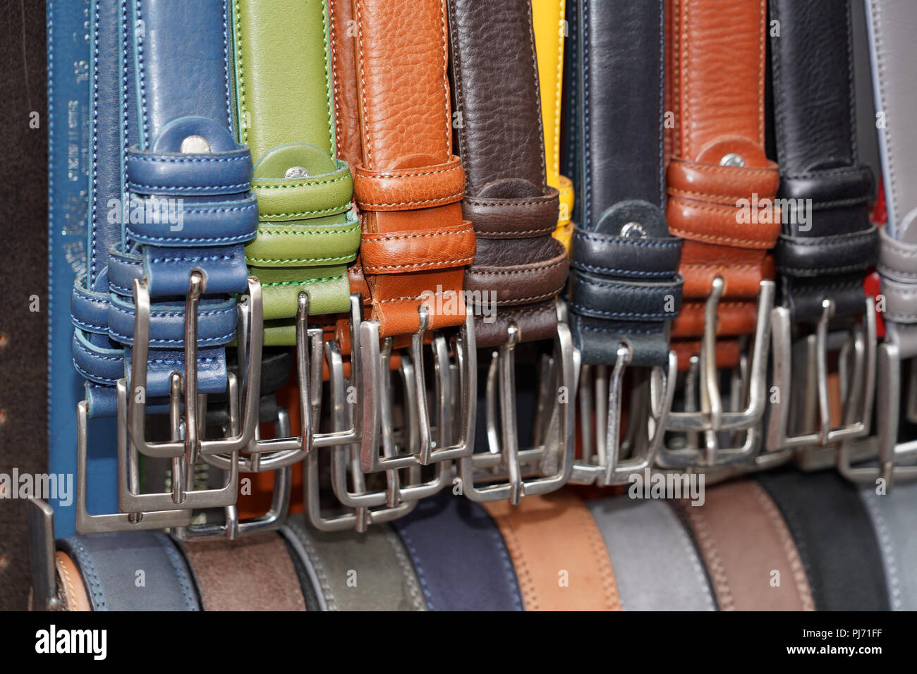 different colors leather belt on display at the market for sale Stock ...