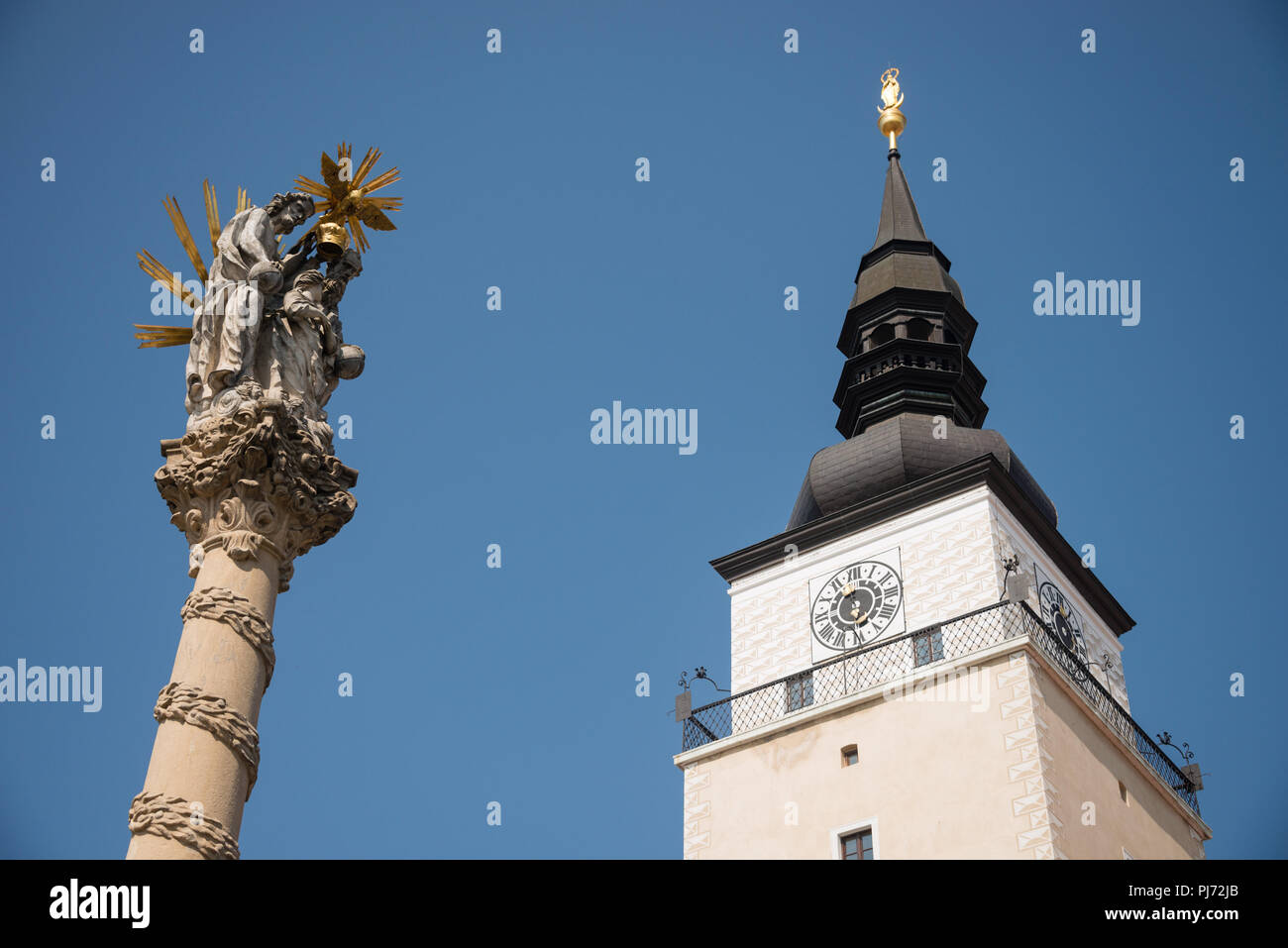 Holy Trinity Column and Town Tower in the center of Trnava city ...