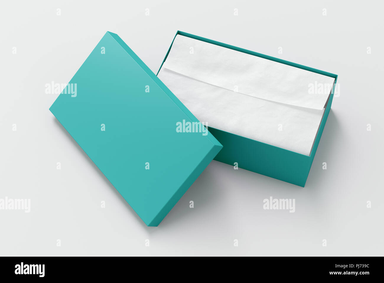 Turquoise shoe box container on white background with wrapping paper ...