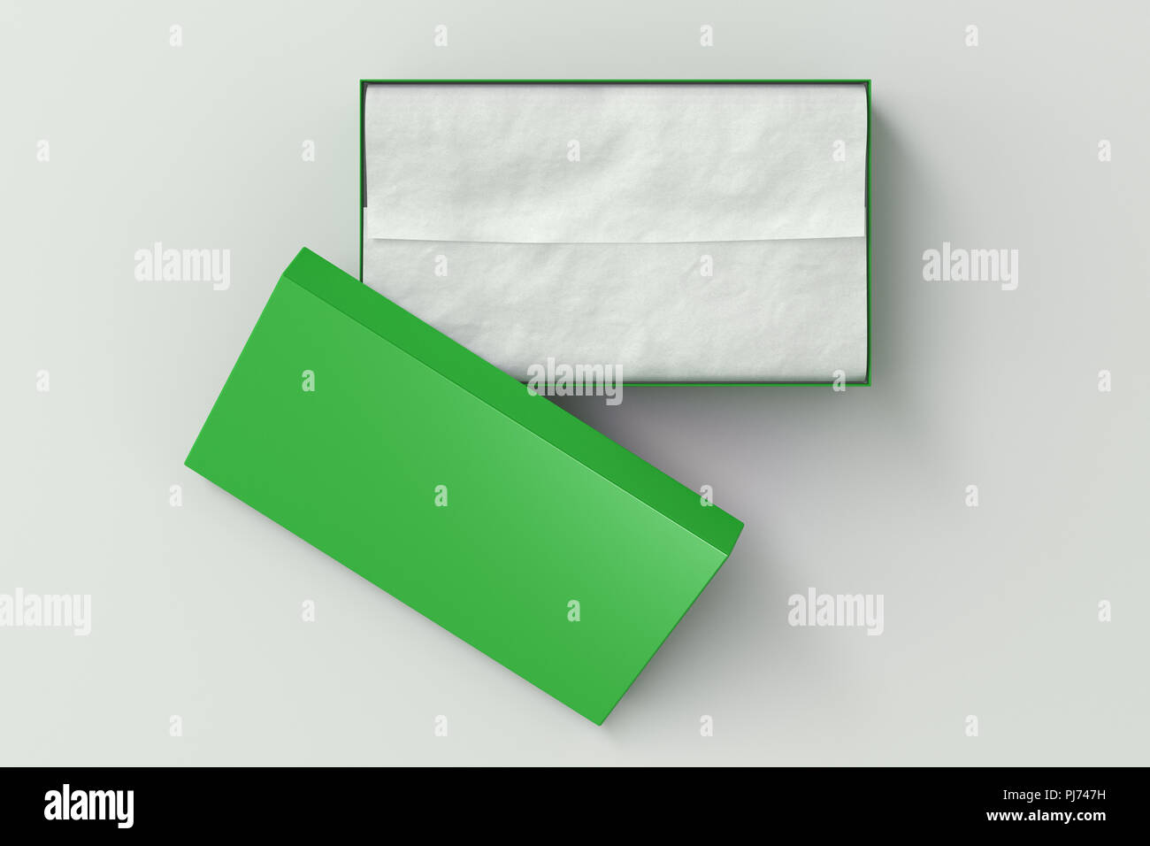 Green shoe box container on white background with wrapping paper ...