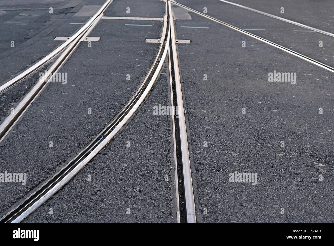Tram tracks on asphalt background in urban city Stock Photo - Alamy