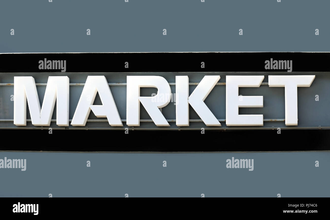 Market sign with white letters on grey wall Stock Photo - Alamy