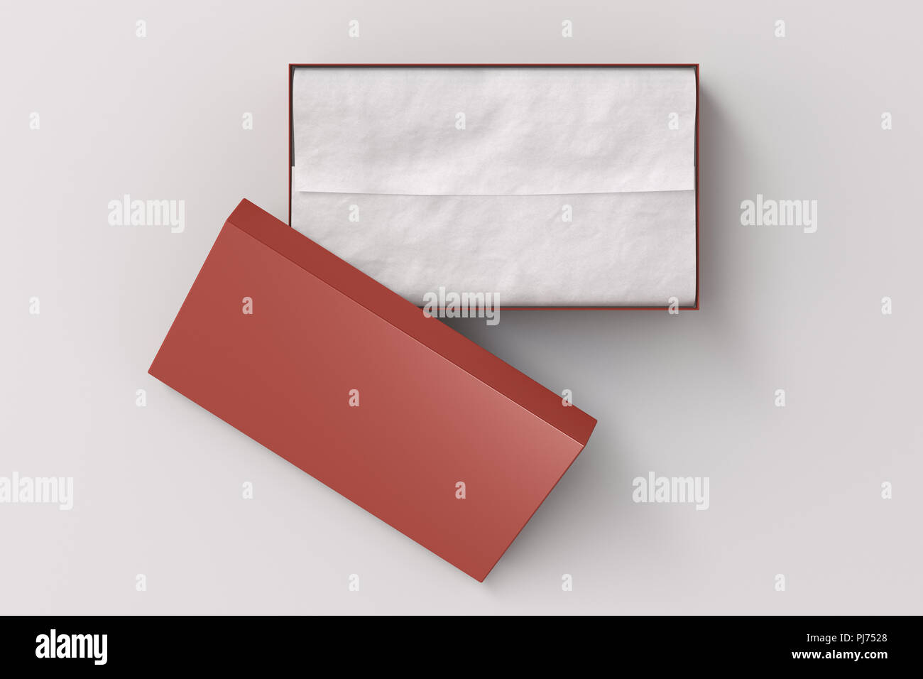Red shoe box container on white background with wrapping paper ...