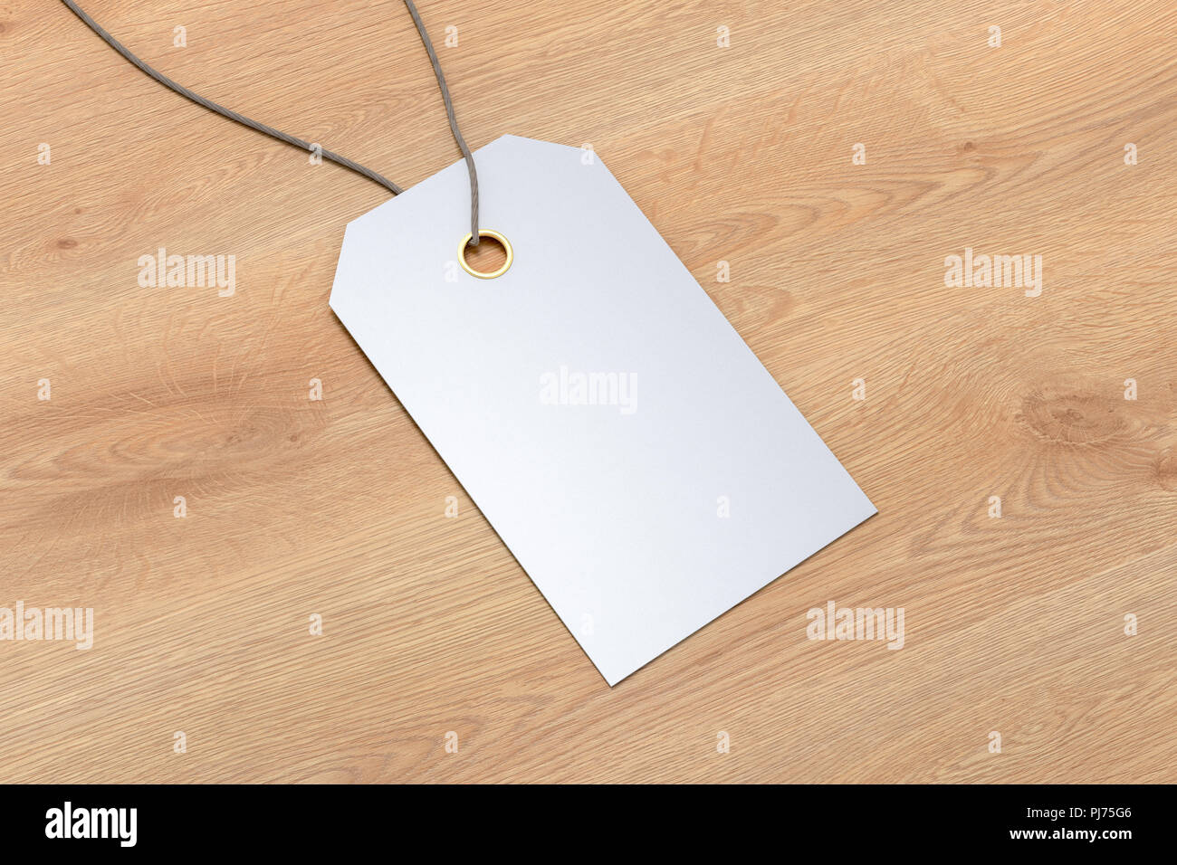 Blank white price tag label mockup on wooden background. 3d ...