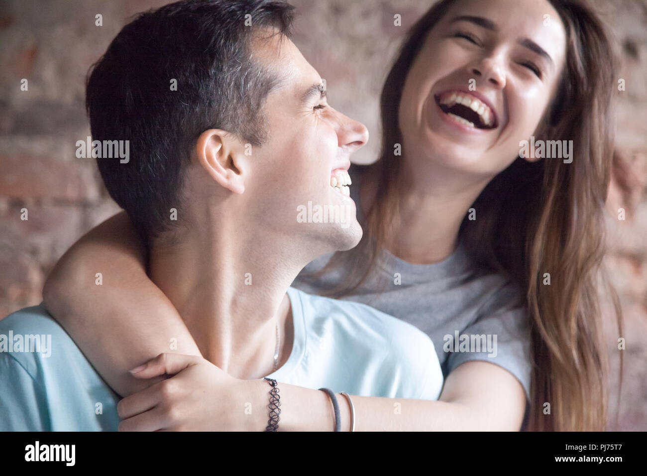 Close up portrait of smiling laughing young man and woman Stock Photo ...