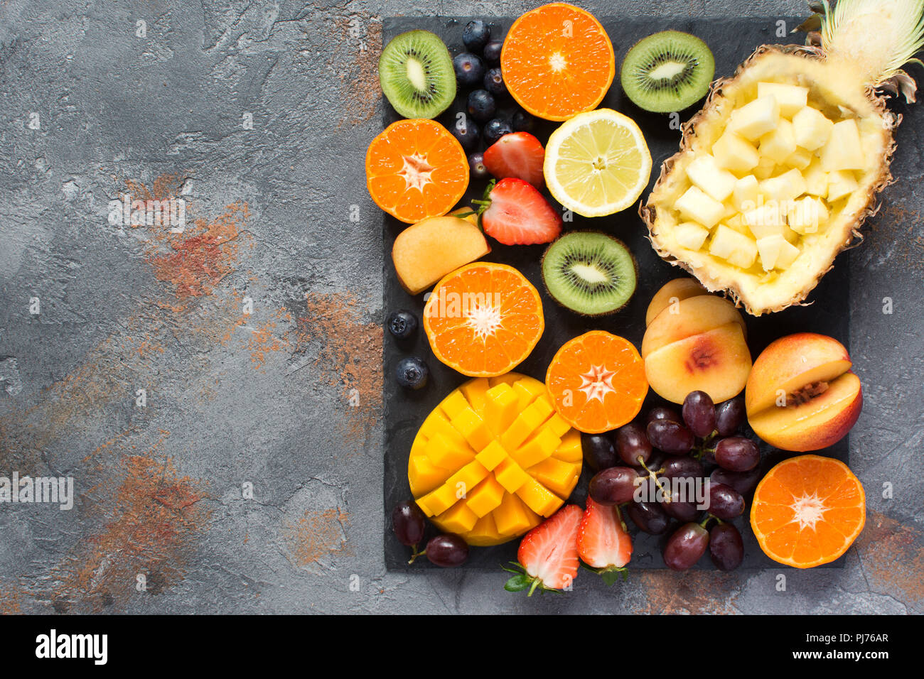 Pineapple, mango, satsuma, kiwi, peaches, oranges, strawberries, grapes ...