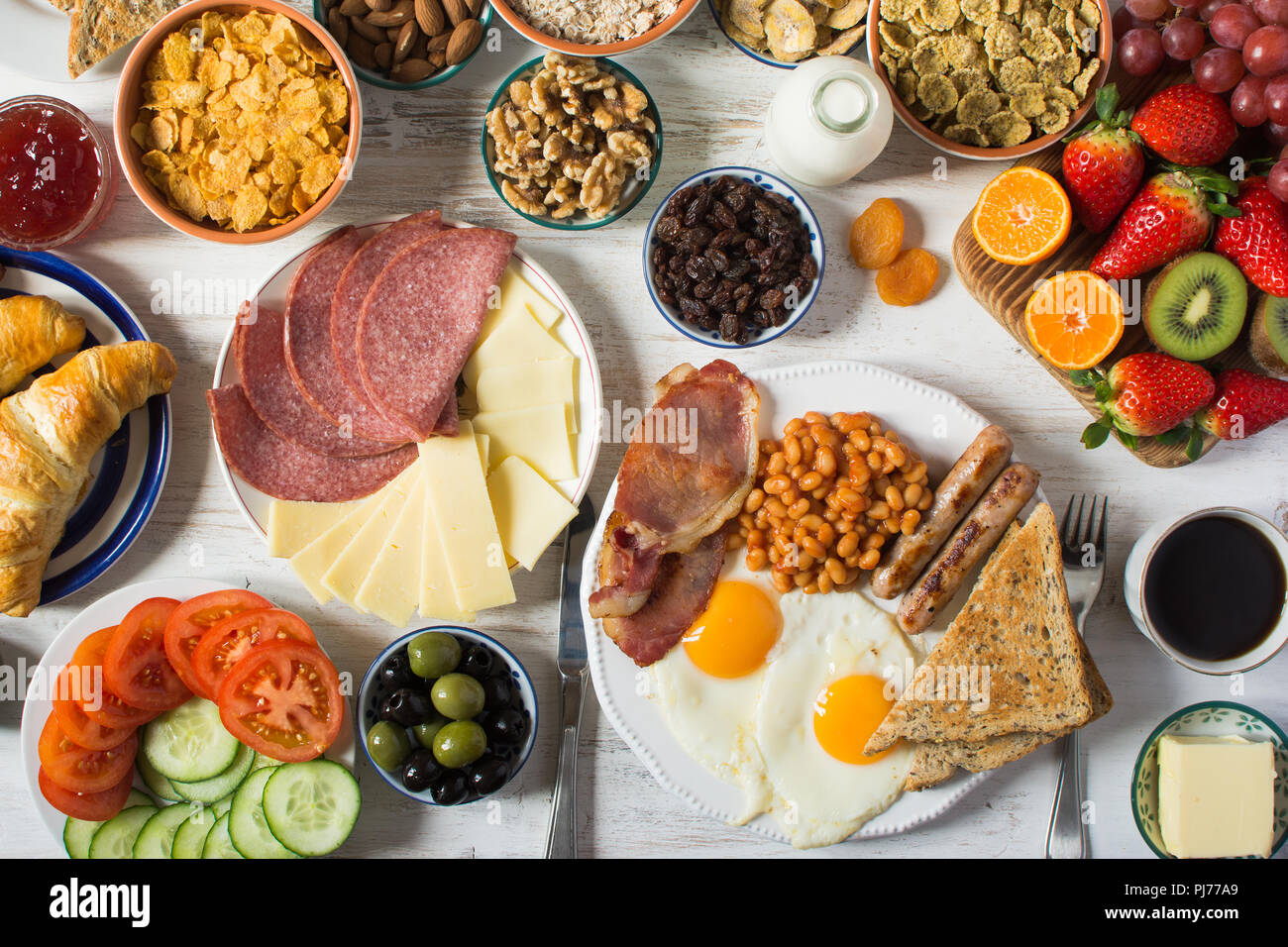 Top view of the healthy filling breakfast, eggs, sausages, bacon, beans ...