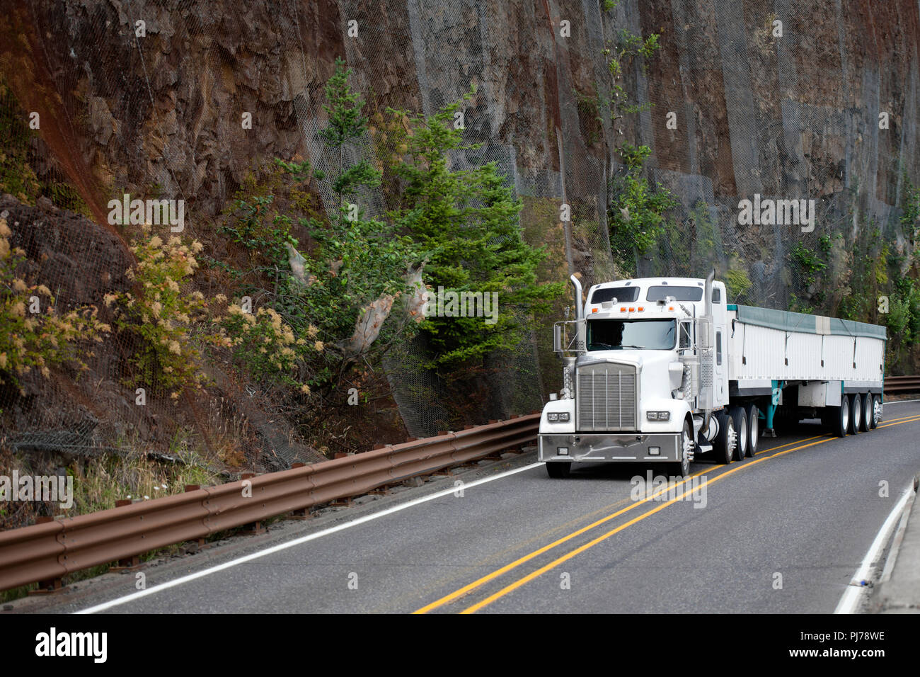 Big rig white classic American model bonnet semi truck tractor with ...