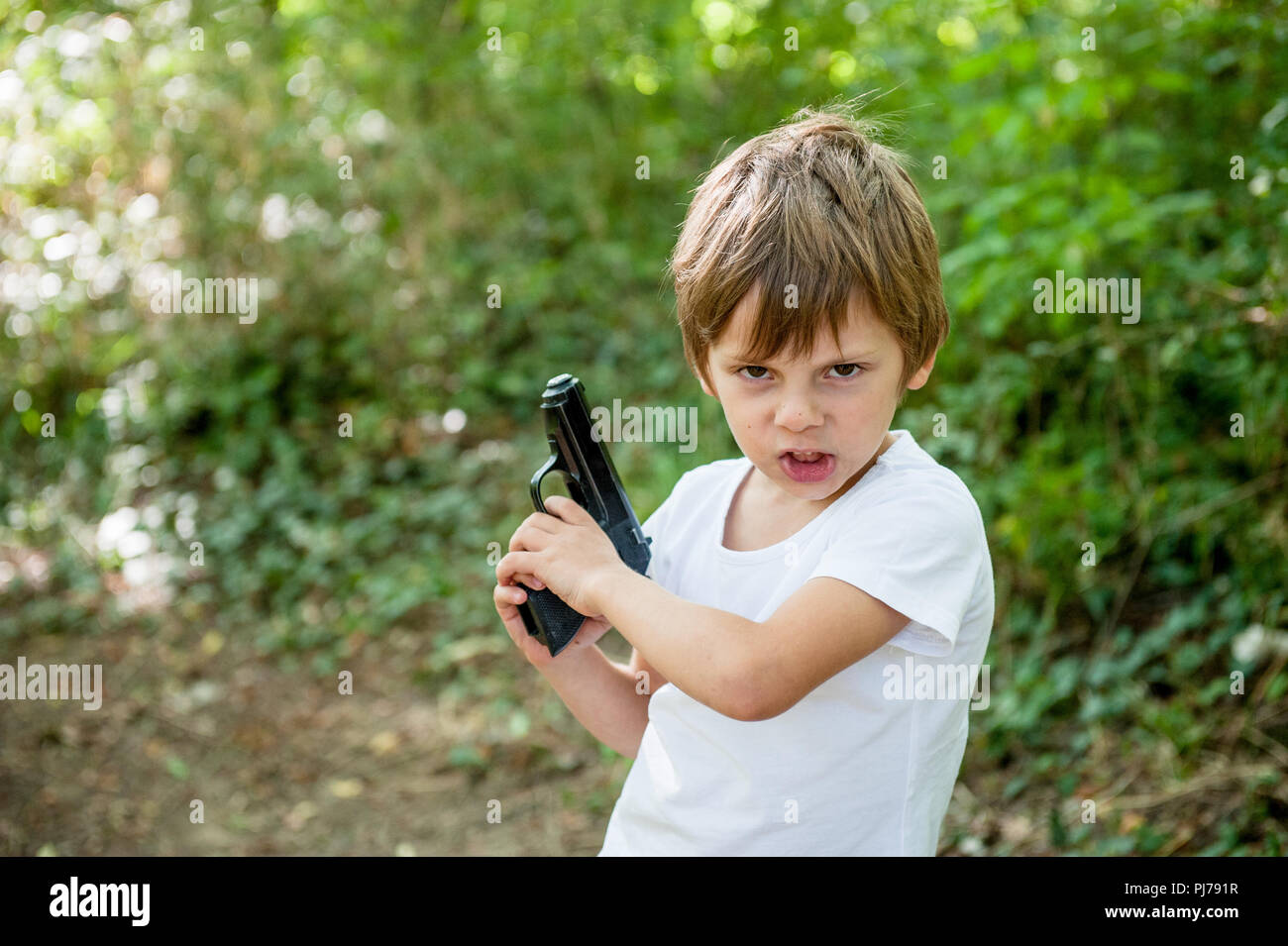 Black kid gun hi-res stock photography and images - Alamy