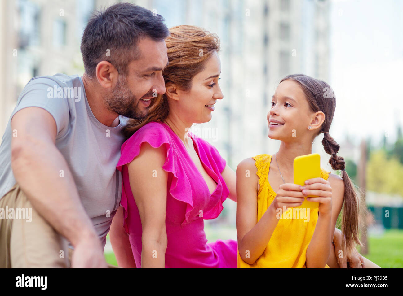 Mother daughter looking smartphone together hi-res stock photography ...