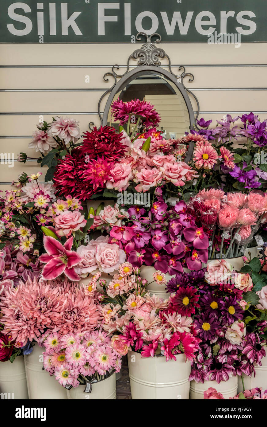 Display of silk flowers at garden centre UK Stock Photo - Alamy