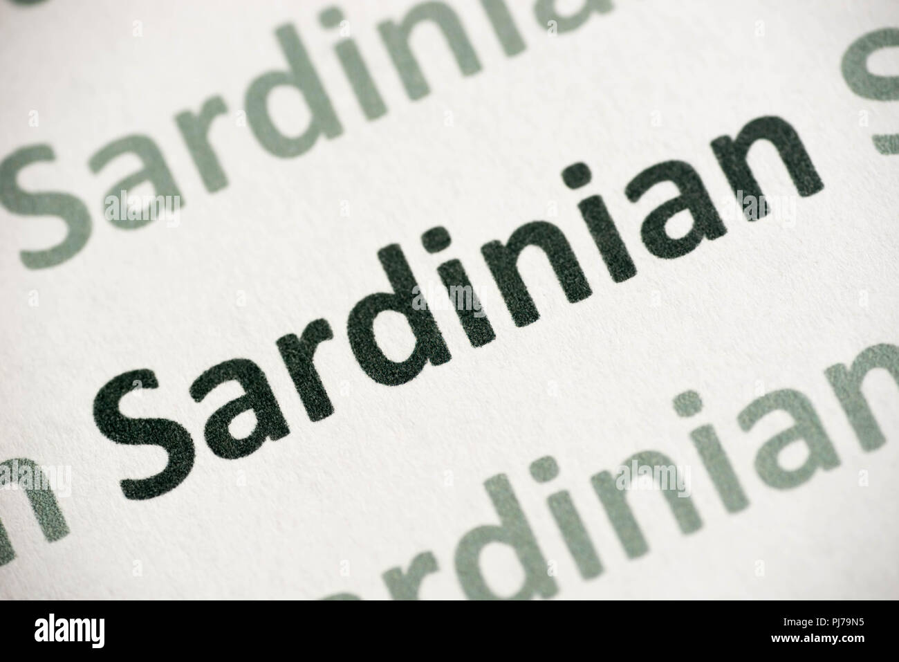word sardinian language printed on white paper macro Stock Photo - Alamy