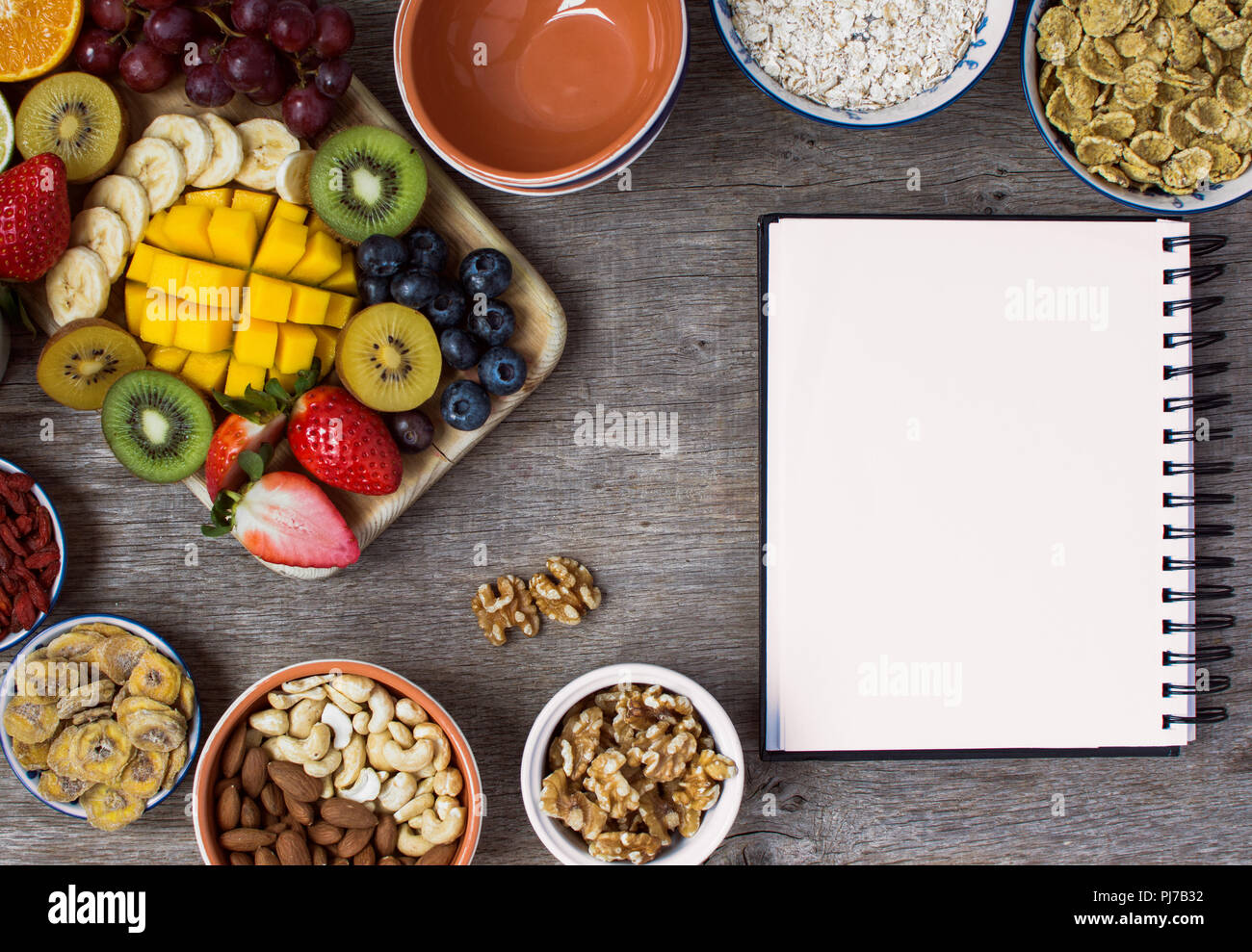 Healthy and various morning breakfast selection: cereals, nuts, fruits ...