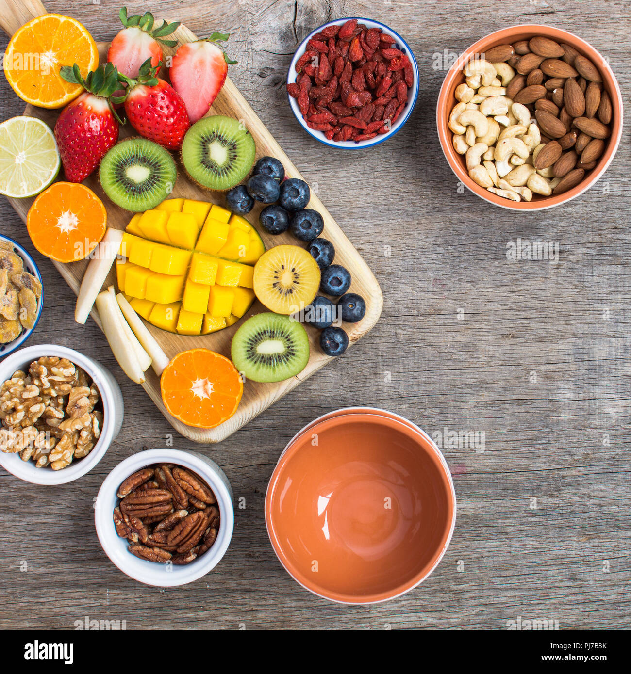 Healthy and various morning breakfast selection: nuts, fruits, berries ...