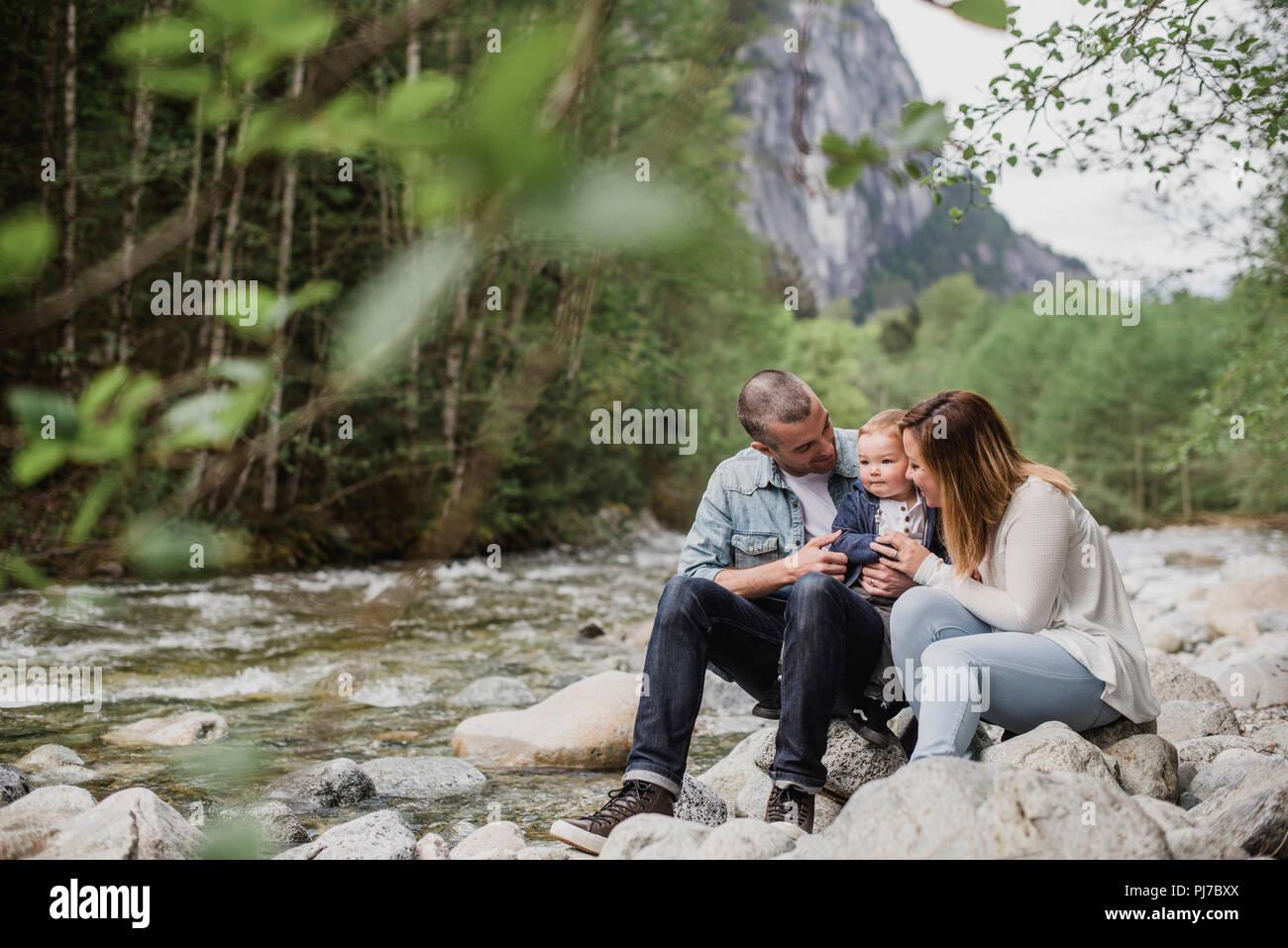 Woman sitting along river hi-res stock photography and images - Alamy