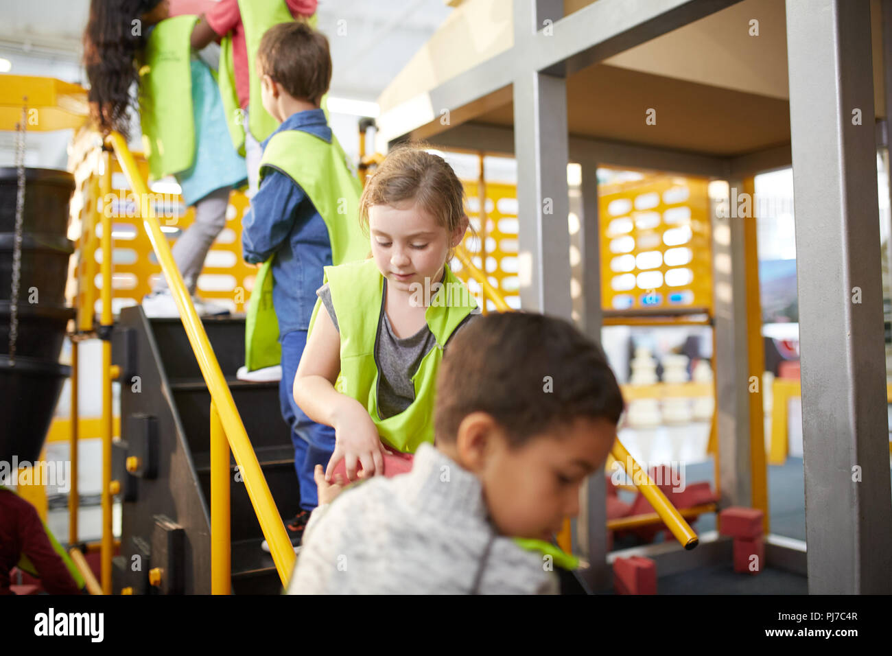 Kids playing at interactive construction exhibit in science center ...
