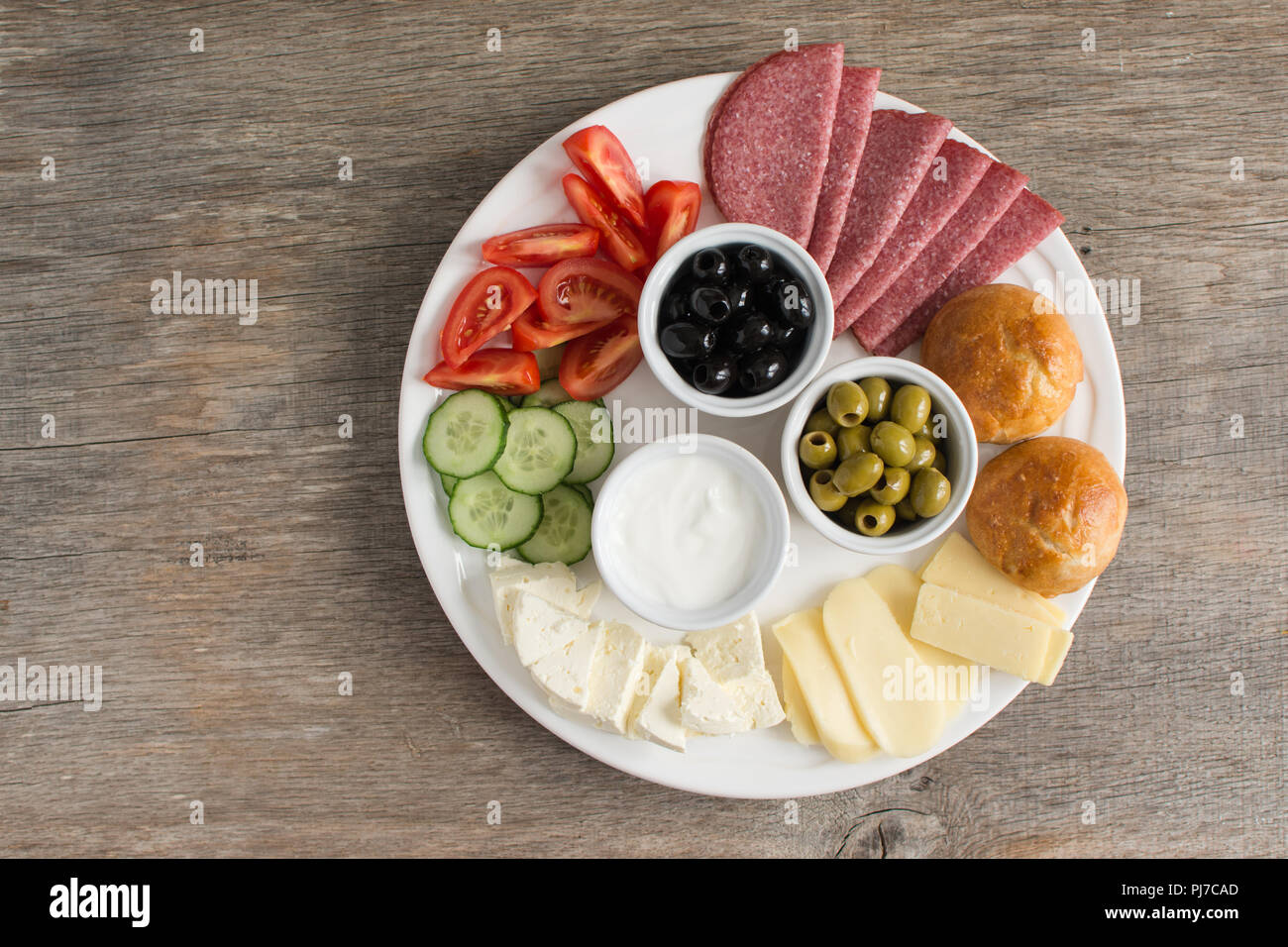 Traditional Turkish breakfast platter on the grey wooden table, top ...