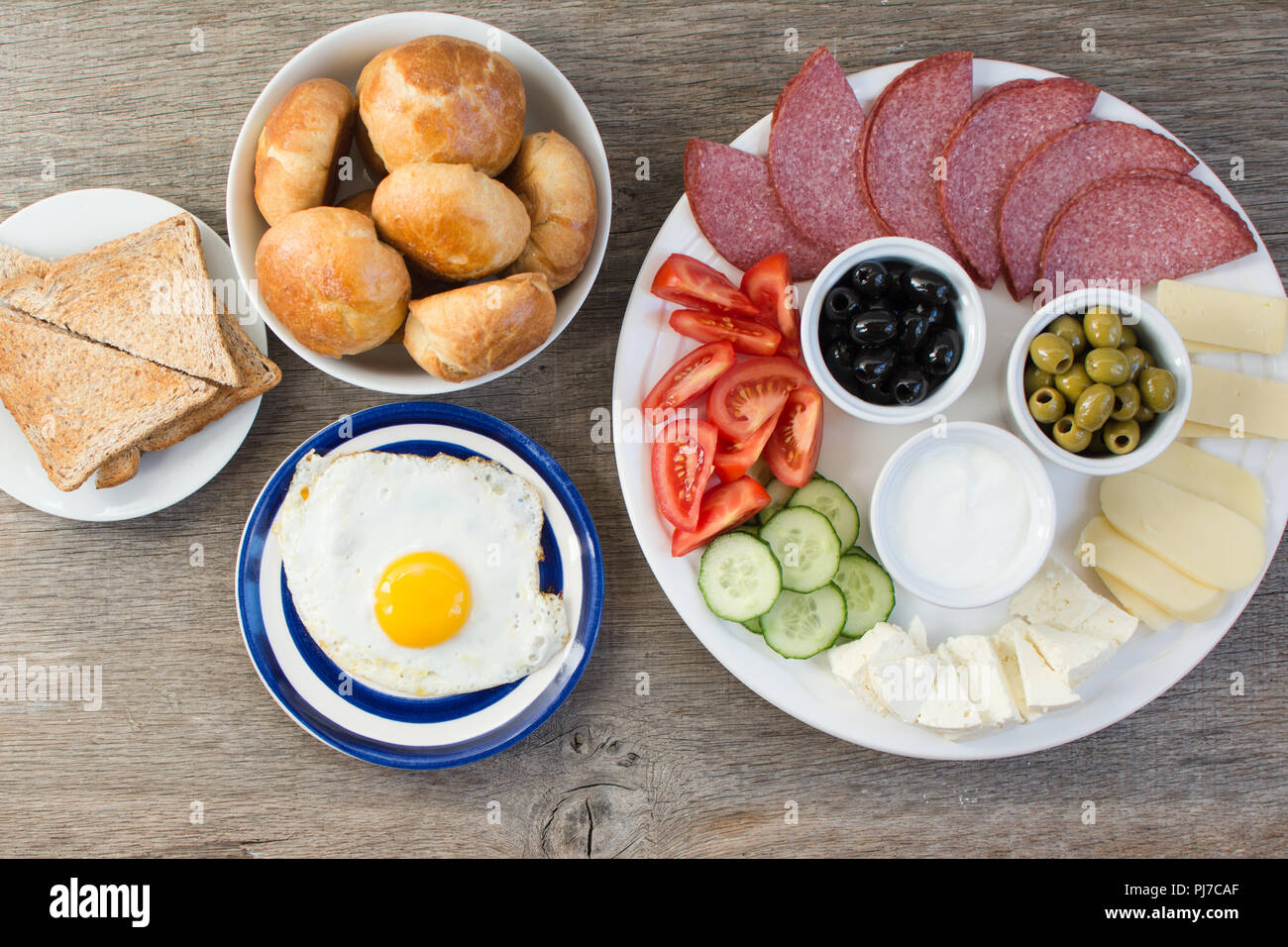 Traditional Turkish breakfast platter on the grey wooden table, top ...