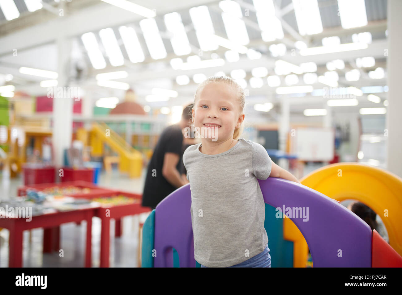 Portrait cute girl playing in science center Stock Photo - Alamy