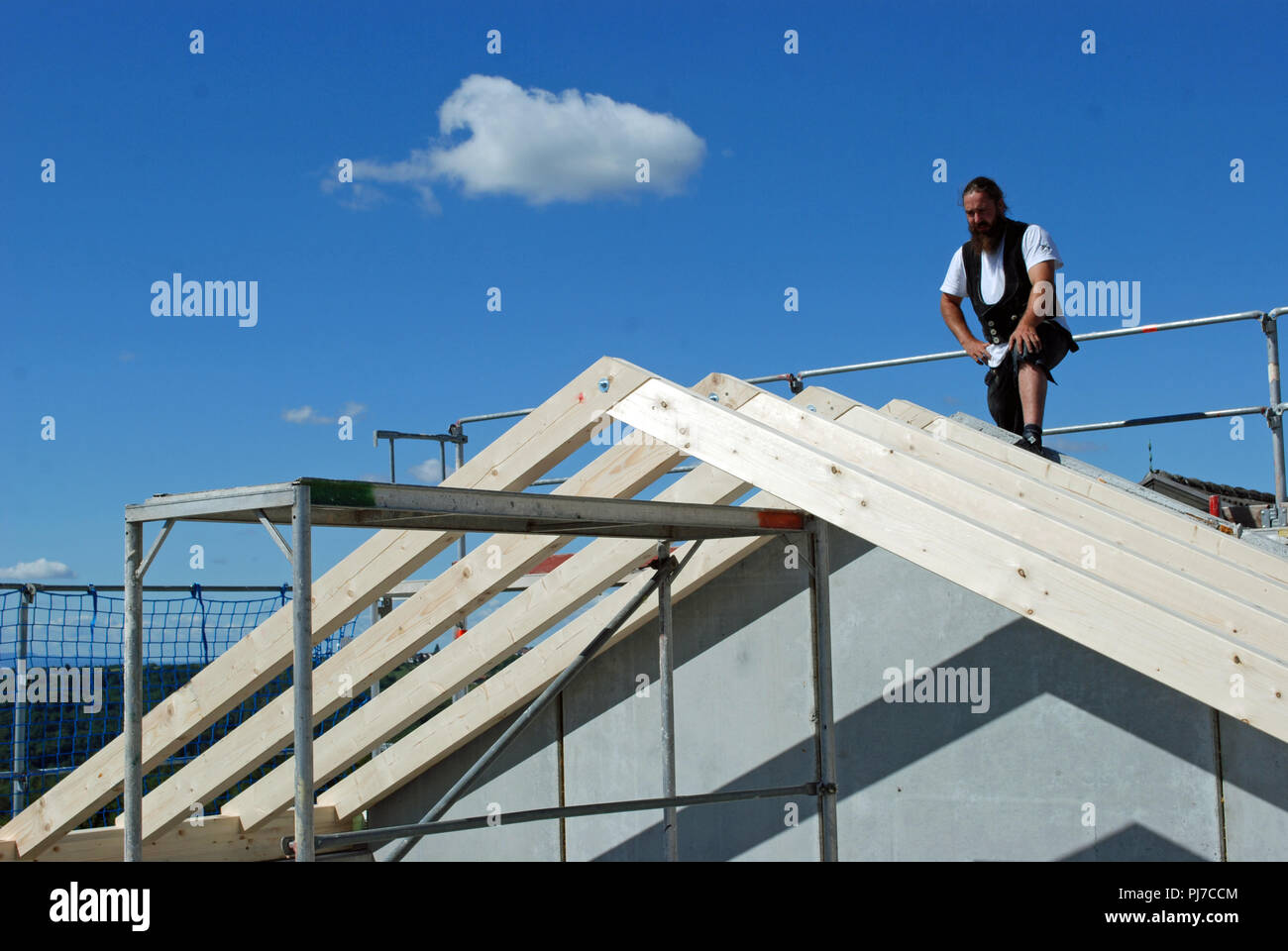 Carpenter working in roof in Lictenwald, Germany Stock Photo - Alamy