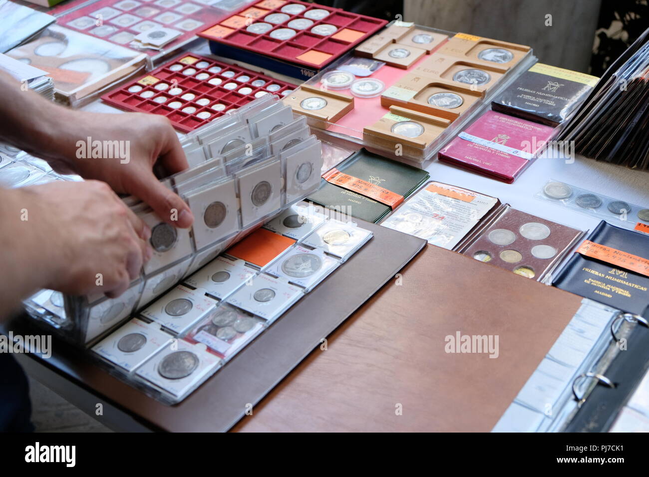 Coins Market in the Plaza del Cabildo in Seville Stock Photo - Alamy