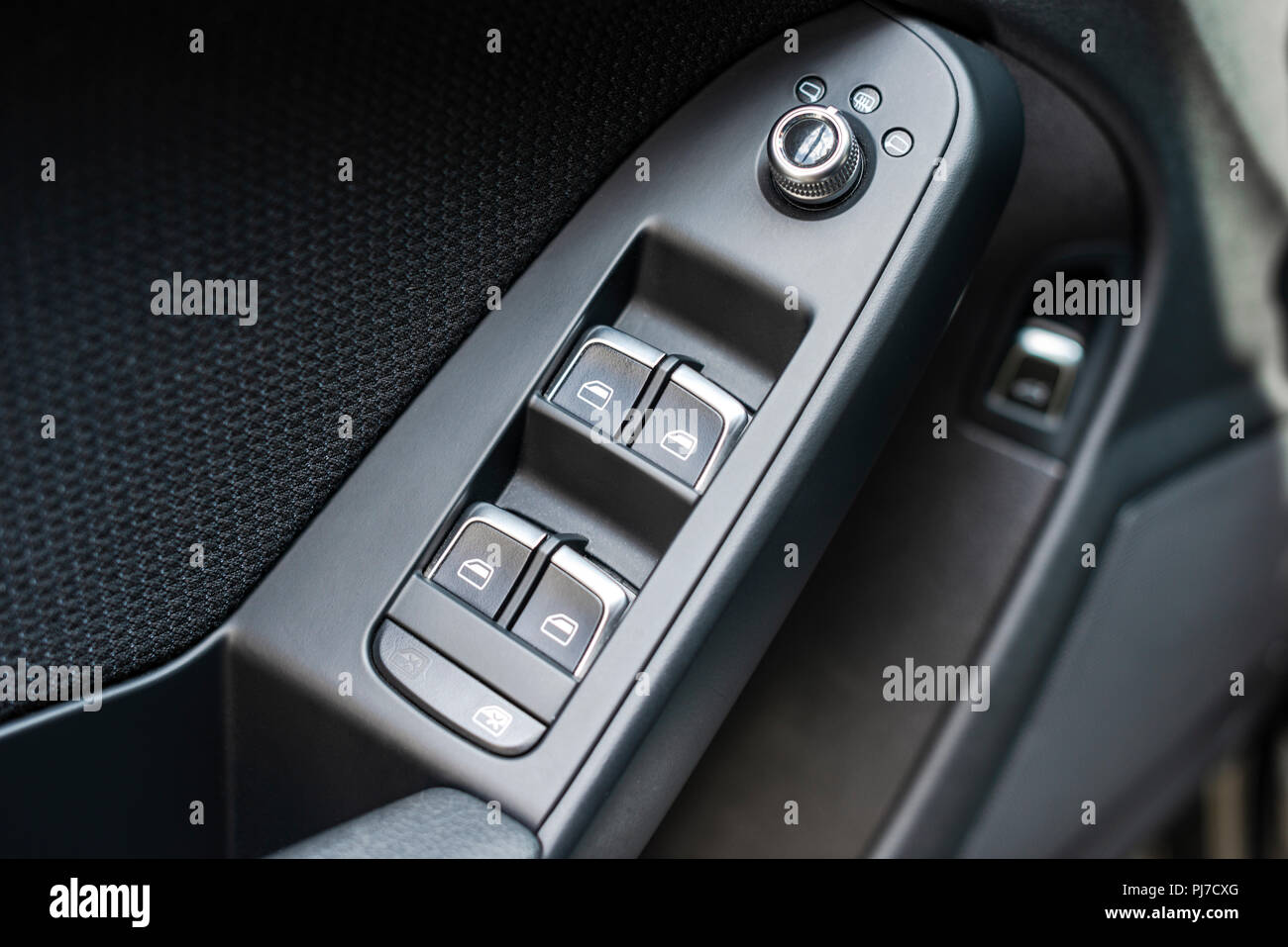 Door handle with Power wondow contol buttons of a luxury passenger car ...