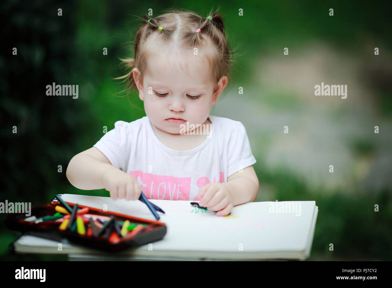 The girl is drawing Stock Photo - Alamy
