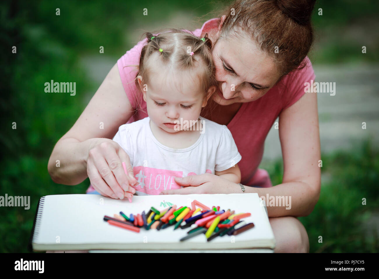 The girl is drawing Stock Photo - Alamy