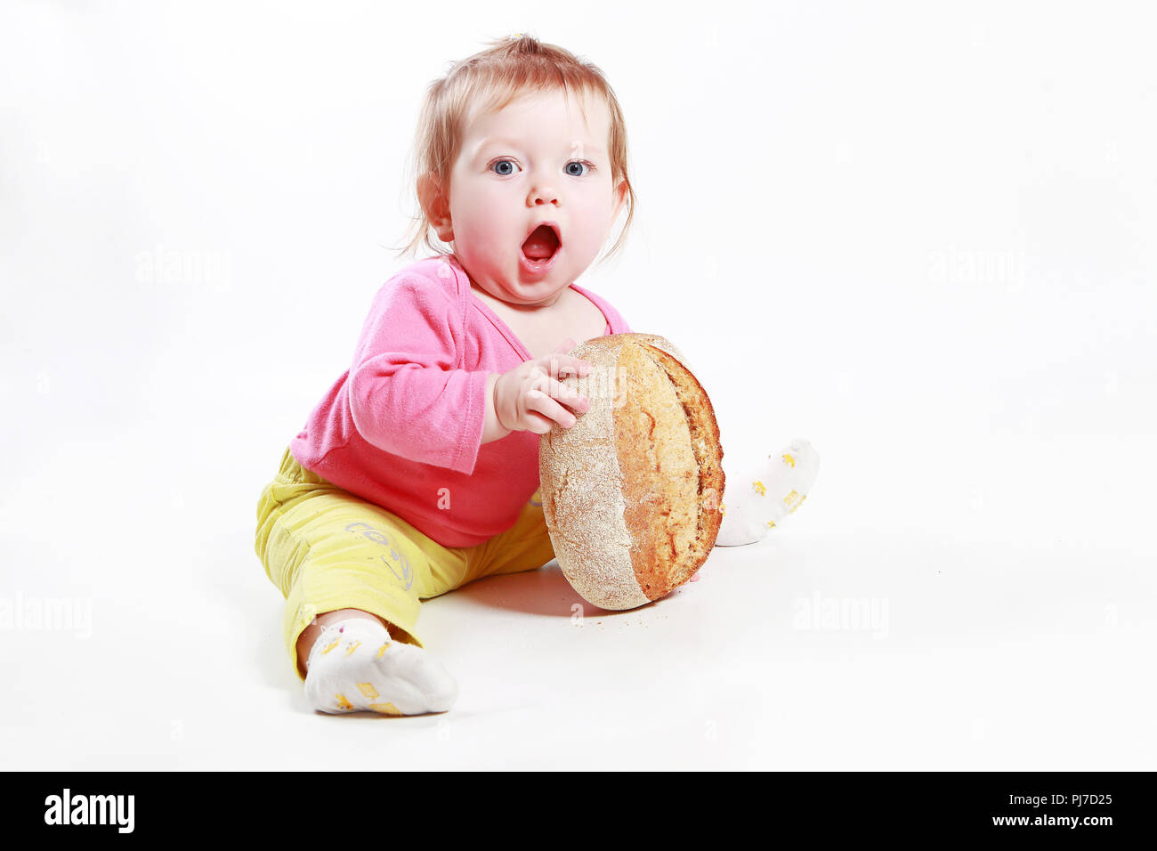 Little child with bread Stock Photo - Alamy
