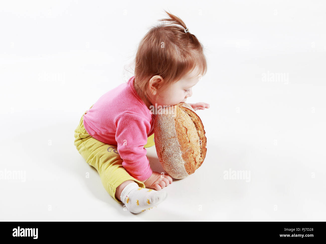Little child with bread Stock Photo - Alamy