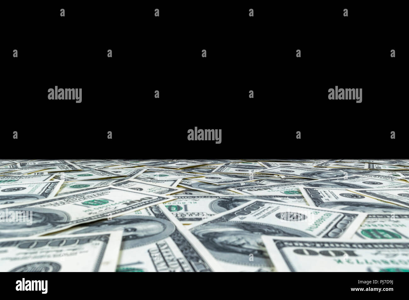 Stack of one hundred dollar bills isolated on black background. Stack ...