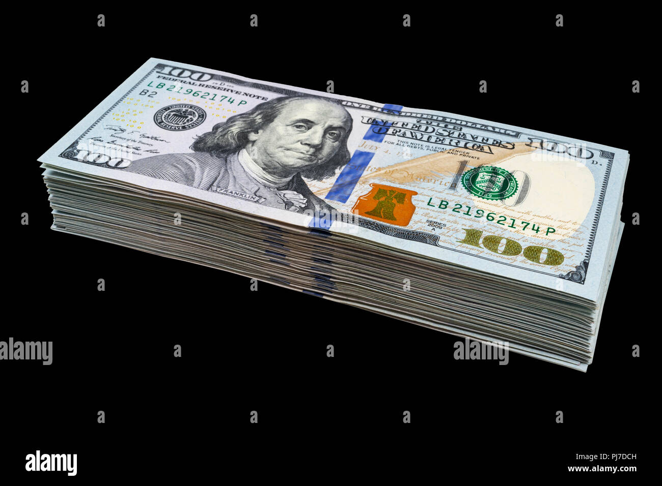 Stack of one hundred dollar bills isolated on black background. Stack ...