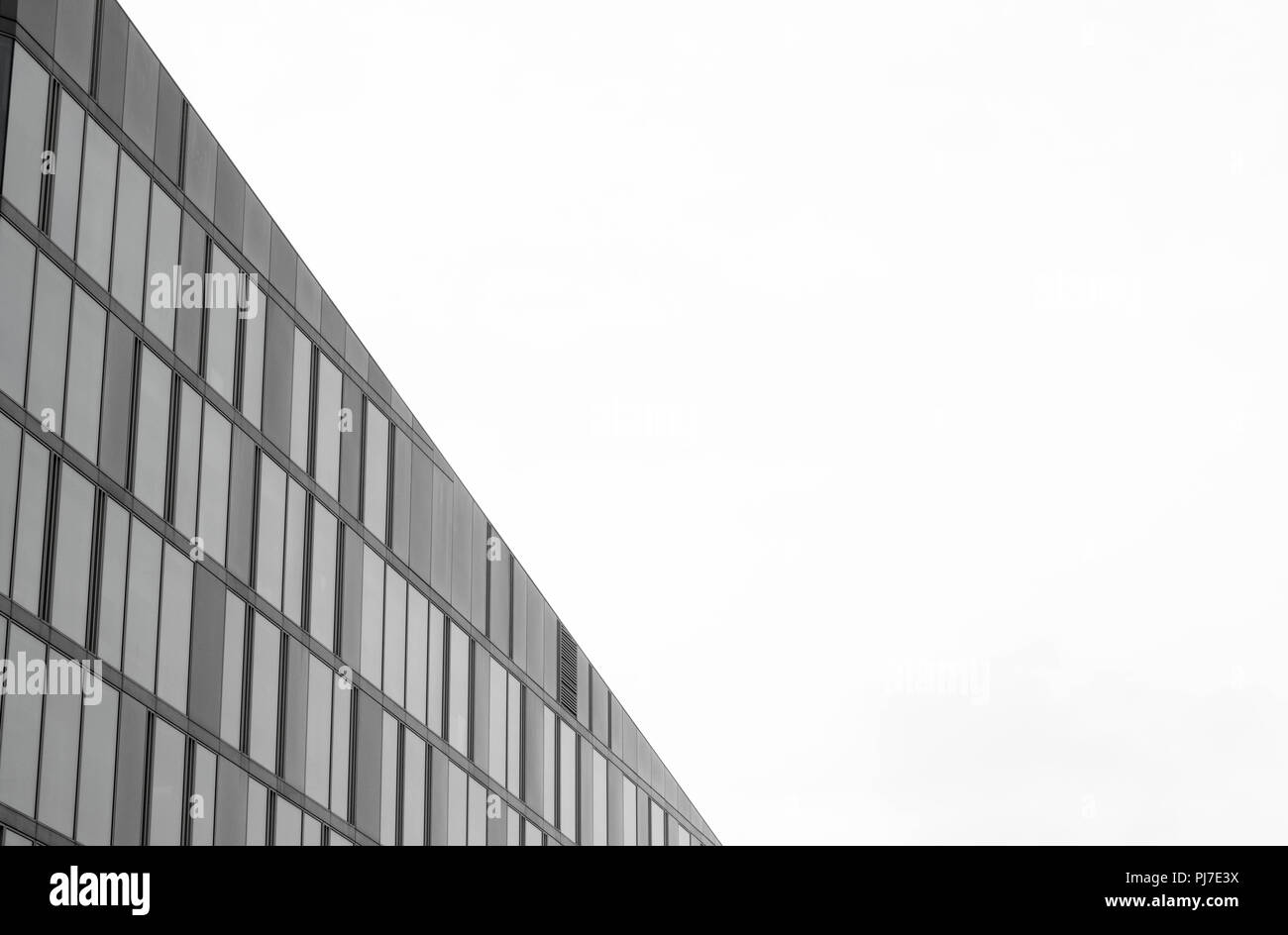 Stunning architectural diagonal shape building with blank space. Black ...