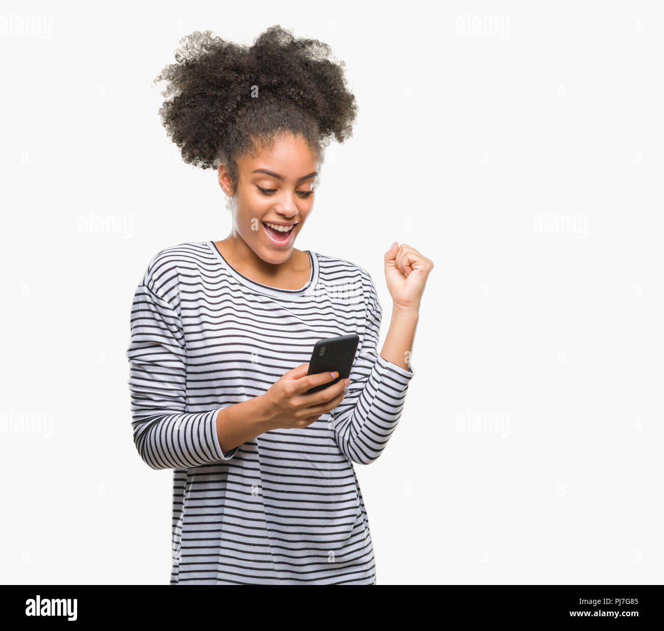 Young afro american woman texting using smartphone over isolated ...