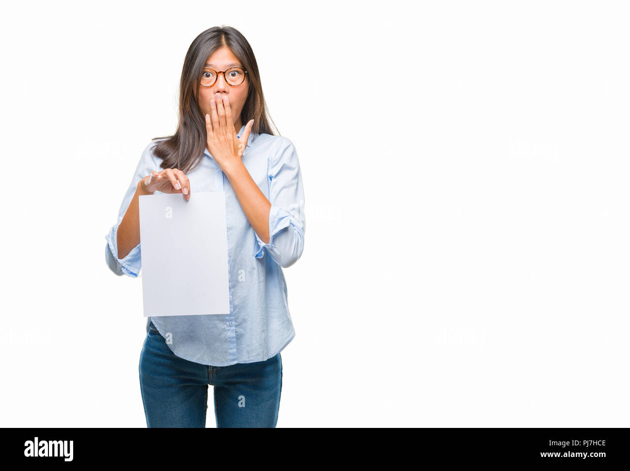 Young asian woman over isolated background holding blank paper cover ...