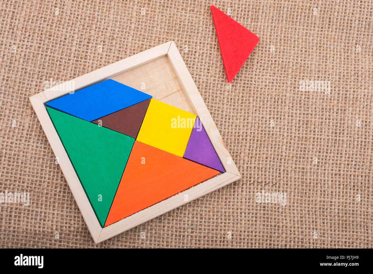 Colorful pieces of a square tangram puzzle Stock Photo - Alamy