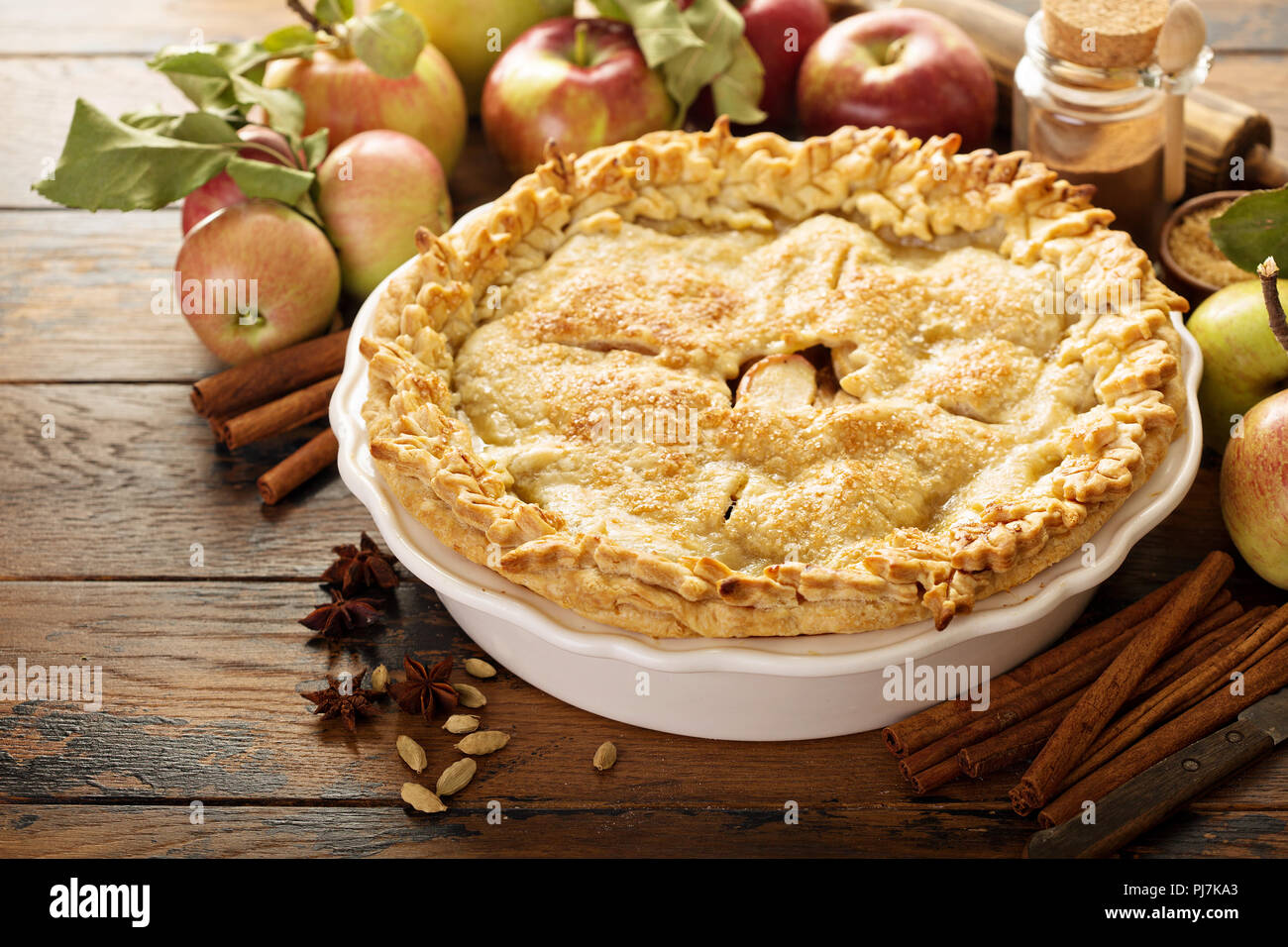Homemade apple pie with leaves cut outs on a rustic background Stock ...